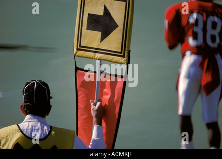 college football lineman referee officials game Stock Photo - Alamy