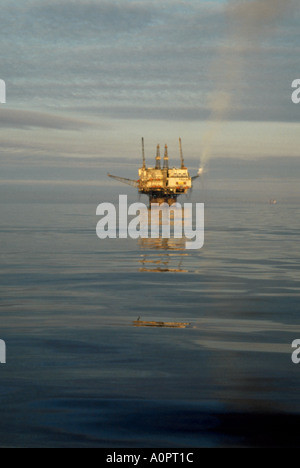 Ninian Central North Sea oil platform seen over an oily sea, Scotland ...