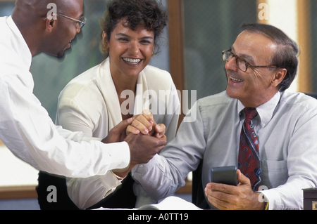 Handshake between african and a caucasian man Stock Photo - Alamy