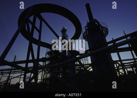 Dramatic photo of fractionating towers and pipe at an oil refinery ...