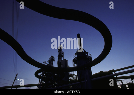 Dramatic photo of fractionating towers and pipe at an oil refinery ...