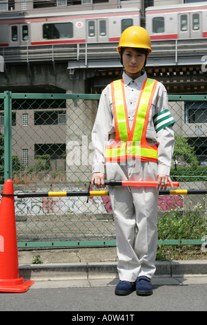 Portrait of a female traffic cop holding a nightstick Stock Photo - Alamy