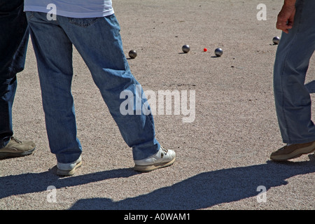 A group of French men playing boule in a small open space in Le Touquet ...