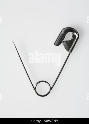 Closeup shot of safety pins on a white background Stock Photo - Alamy