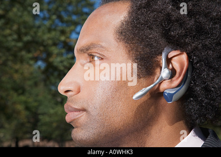 Businessman wearing a bluetooth headset Stock Photo - Alamy
