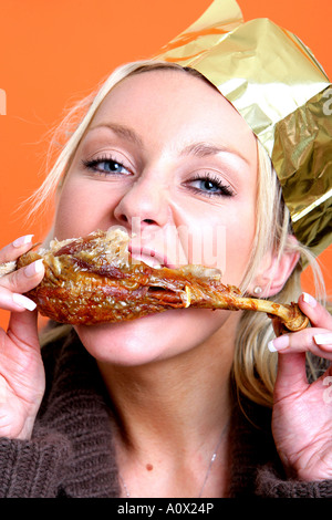 Young Woman Eating Turkey Drumstick Model Released Stock Photo - Alamy