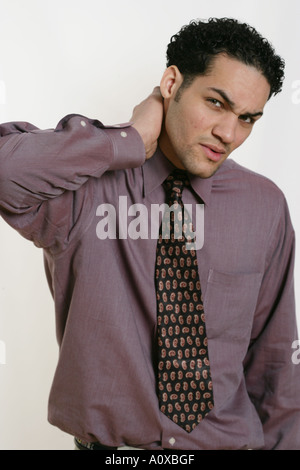 Man holds on to sore head temples. Pain, migraine, headache, aching ...