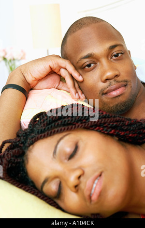 African couple napping together Stock Photo - Alamy