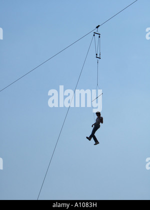 woman entertainer trapeze artist hanging on high wire rope Stock Photo ...
