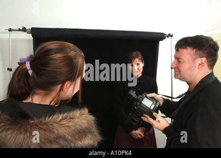 Photographer giving direction to a Model in his Studio Stock Photo - Alamy
