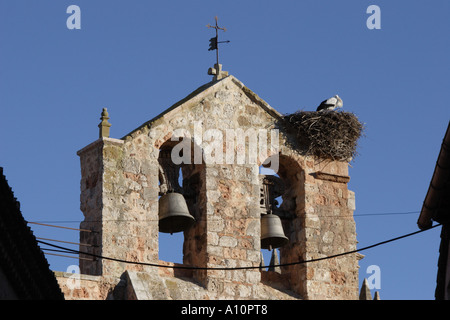 Cross, weather vane and stork in its nest on the roof of a tower Stock ...