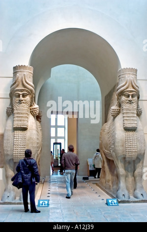 Winged human-headed bull. Human figure with baby lion. Sumerian and ...