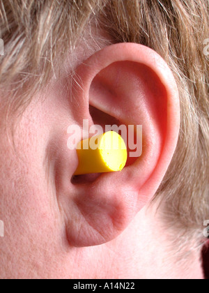 ear with ear stopper Stock Photo - Alamy