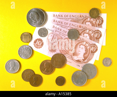 British pre decimal coins and 1 Pound banknote, UK, on white background ...