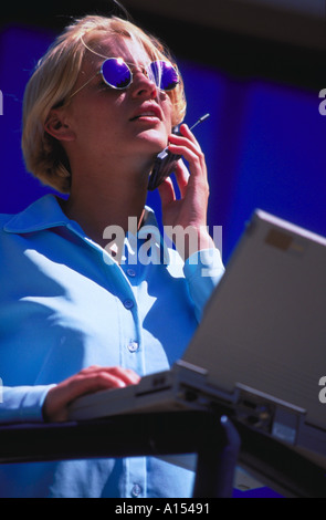 Person using phone while standing on colorful steps Stock Photo - Alamy