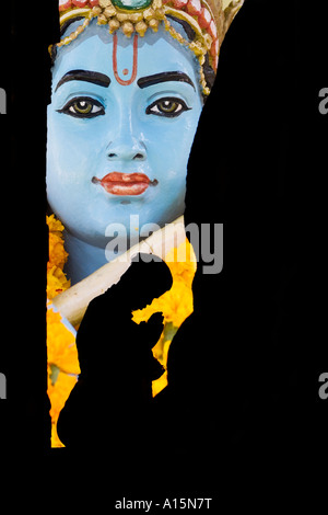Silhouette of young man praying on dark background Stock Photo - Alamy