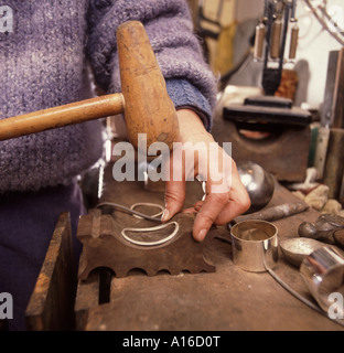 The tools of traditional silversmith working on jewellery Stock Photo ...