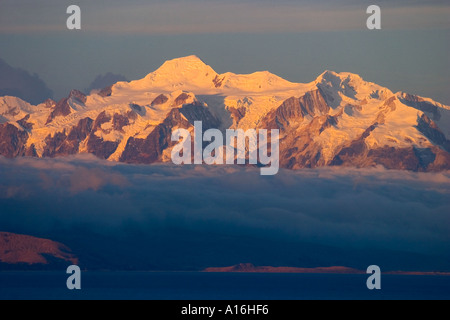Sunset over mounts Illampu 6368 m and Ancohuma 6427 m Bolivia Stock ...