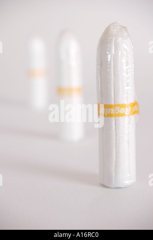 three feminine hygiene tampon on white background Stock Photo - Alamy