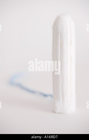 Single unwrapped tampon on a white background Stock Photo - Alamy