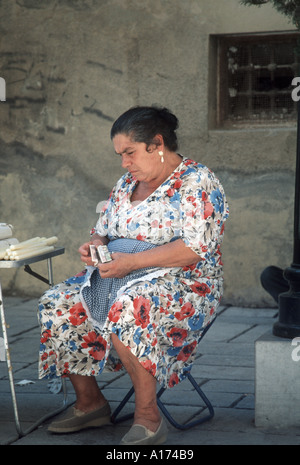 Gypsy woman female street vendor selling tomatoes by impromptu stall on ...