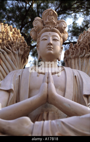 Multiple heads and arms godess in a Hong Kong temple Stock Photo - Alamy