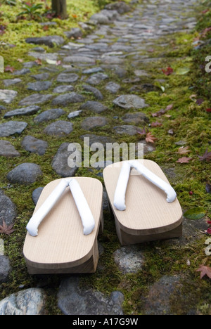 Man's geta on a stone path in a Japanese garden Japan Stock Photo - Alamy