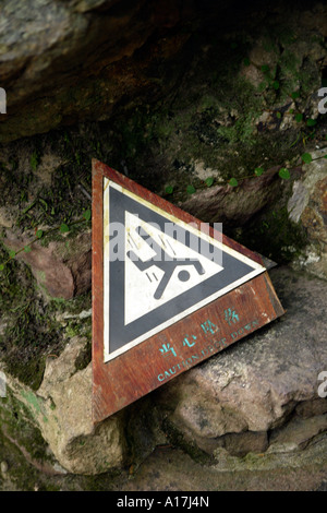 Chinese warning sign: slippery Stock Photo - Alamy