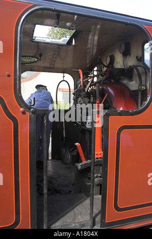 Footplate and cabin of a steam locomotive engine, showing dials, levers ...