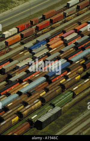 railroad transportation, freight cars in industrial seaport at sunset ...