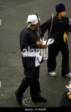 sikh men male swords ceremonial display Stock Photo - Alamy