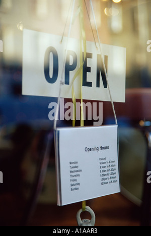 open sign in shop window - open sign in store entrance Stock Photo - Alamy