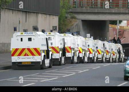 Line of PSNI RUC Police land rovers in reserve outside North Queen ...