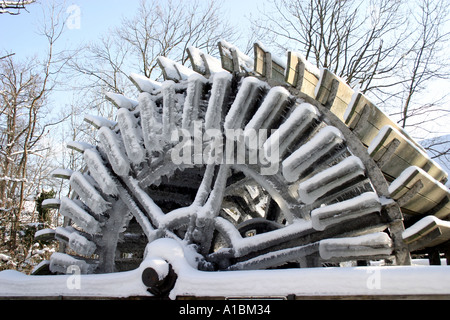 Old paper mill wheel with icicles at the river Wuerm in Gauting near ...