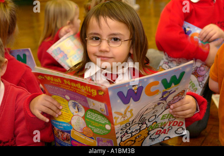 Pupils reading a Welsh language magazine in class at a Welsh speaking ...
