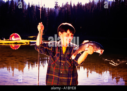 Handsome boy of ten years in the spring garden. Close-up portrait of a ...
