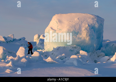 Stacy Hopson walks by a giant ice ball on the frozen Chukchi Sea during ...