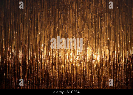 Abstract background sunset through mottled glass 4 Stock Photo - Alamy