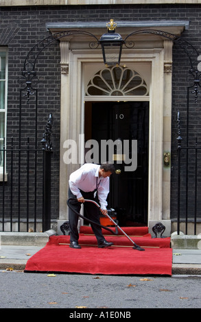 A street cleaner at work outside number 10 Downing Street, Westminster ...