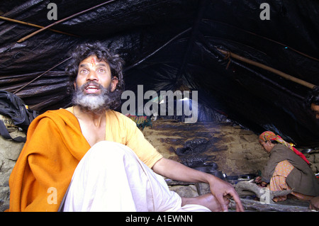 Indian holy sadhu yogi magi in shelter in mountains above Kullu Valley ...