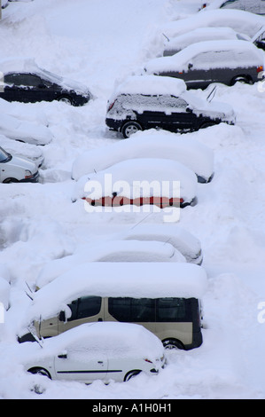 Car Blanketed in Heavy Snow with Aluminum Windshield Protection Stock ...