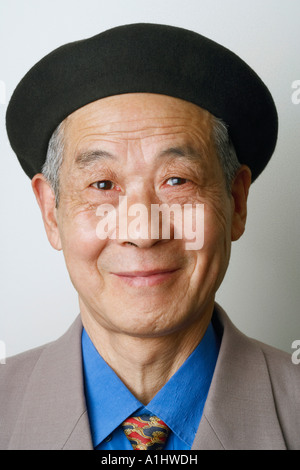 Studio shot of cheerful senior Chinese man Stock Photo - Alamy