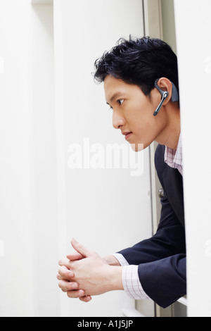 Young asian man wearing business suit and tie looking confident with ...