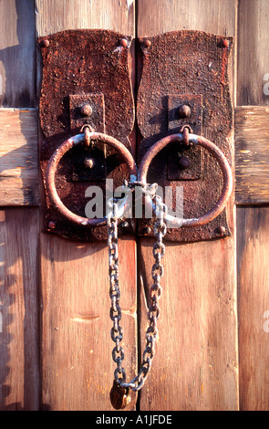 Door handles chained closed with padlock Stock Photo - Alamy