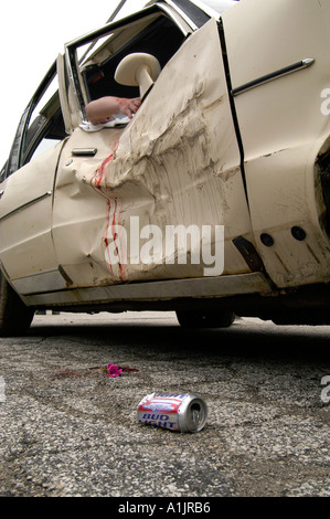 Prom Drunk Driving Demo Beer Can on Ground Near smoking crash car ...