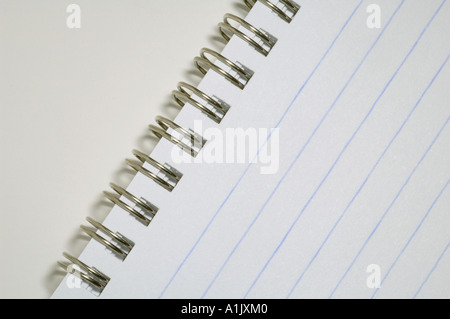 Blank horizontal spiral notepad on wooden background. With clipping ...