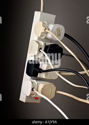 A dangerously overloaded electrical socket Stock Photo - Alamy