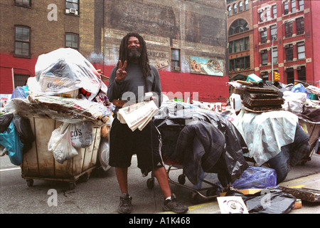 homeless man with all his belongings walking the streets during the day ...
