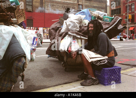 homeless man with all his belongings walking the streets during the day ...