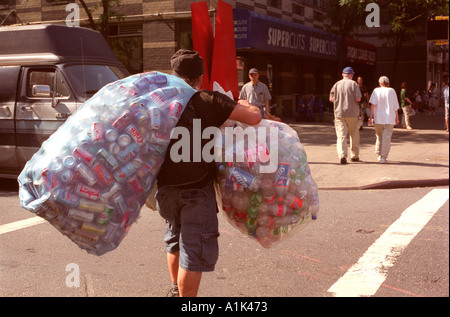 Homeless man collecting tin cans to recycle for money Stock Photo - Alamy